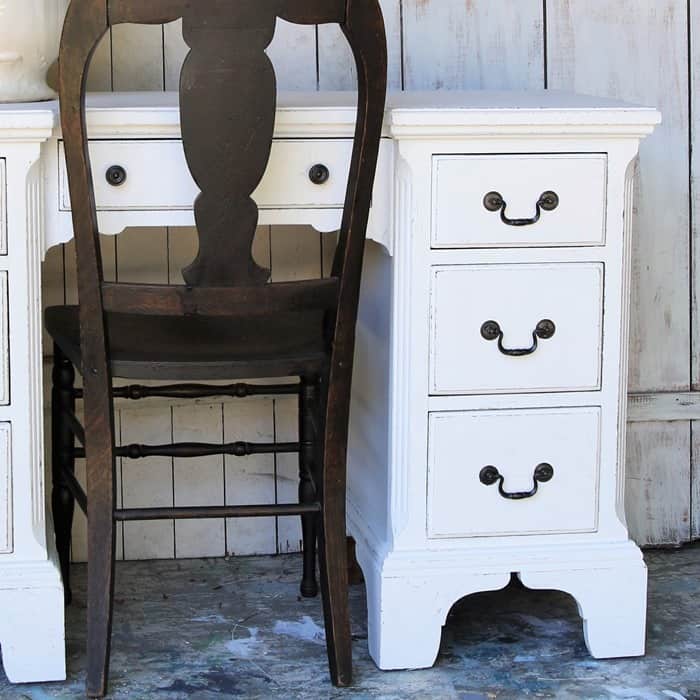 Grungy Desk Makeover With Distressed White Paint And Metallic Hardware